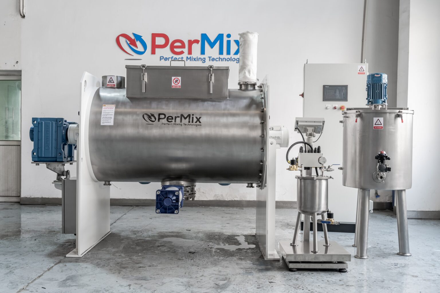 Atomizing Liquids in Paddle Mixer Powder Blending